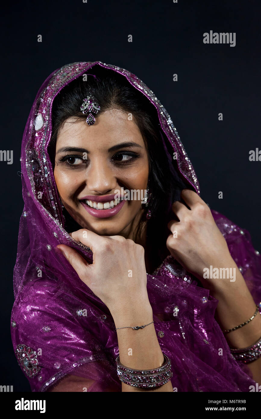 Portrait of smiling beautiful indian girl. young female model wears ...
