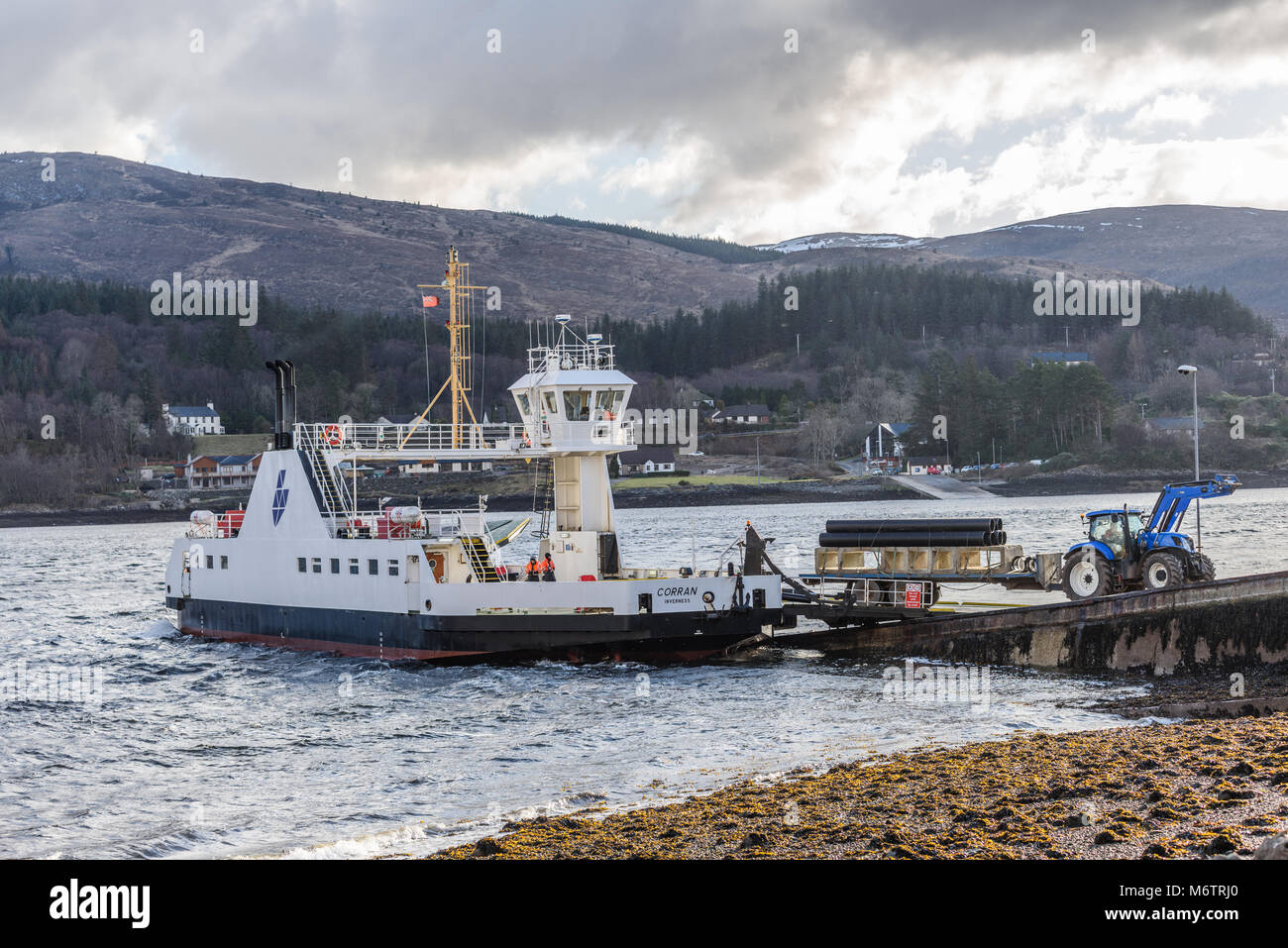 A tractor with its load leaves the Corran ferry on the Ardgour side at ...