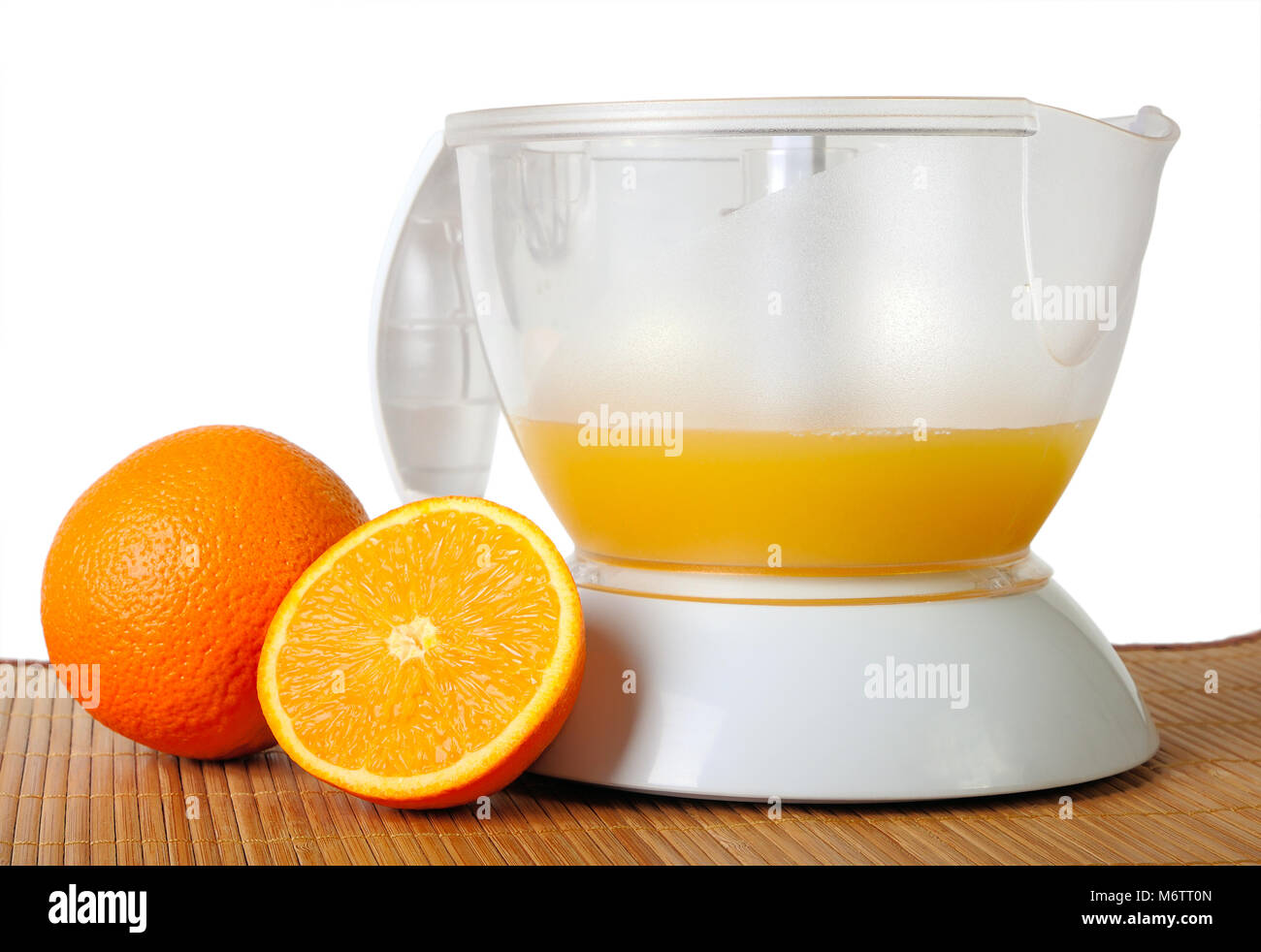 Still life with a juice extractor isolated on mat Stock Photo - Alamy