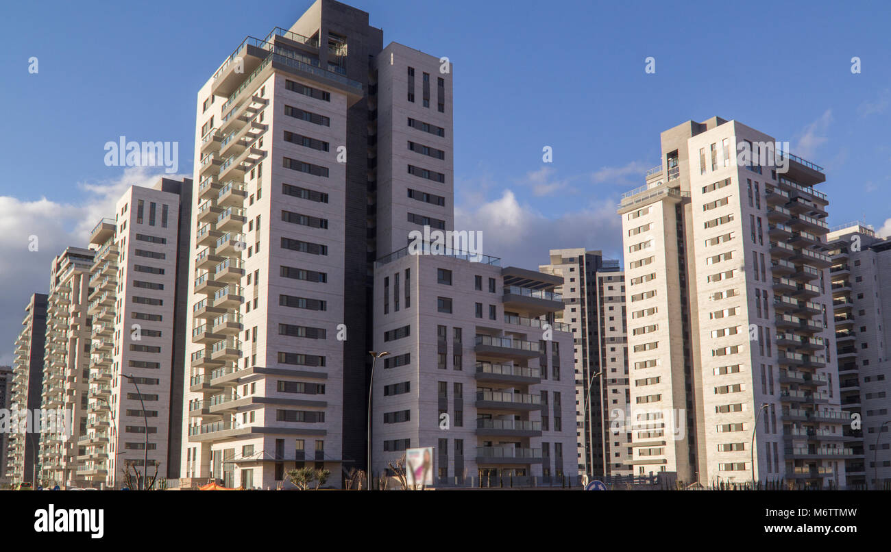High rise tower crane and new residential buildings front view. Urban ...