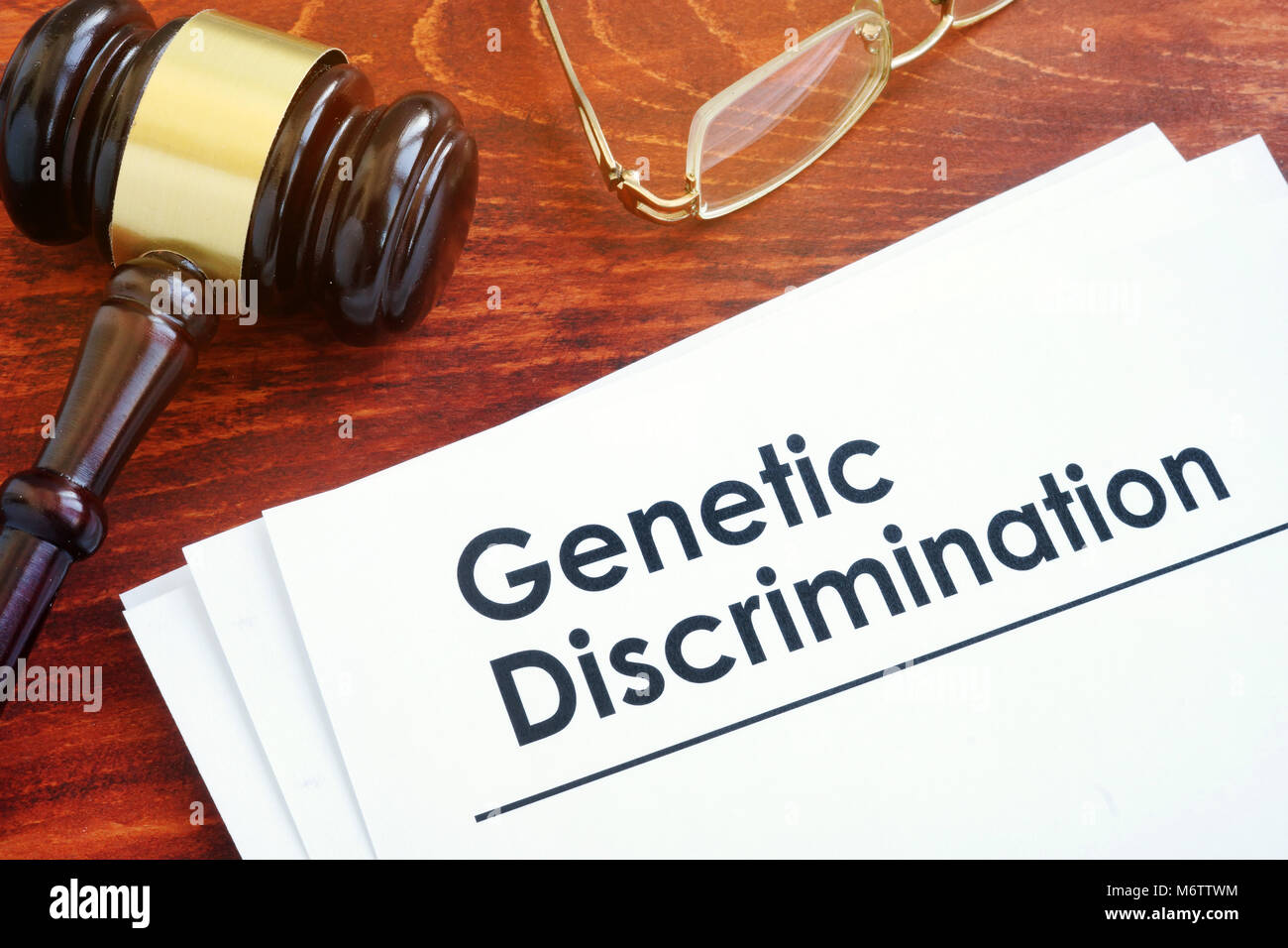 Papers about Genetic Discrimination and gavel Stock Photo - Alamy