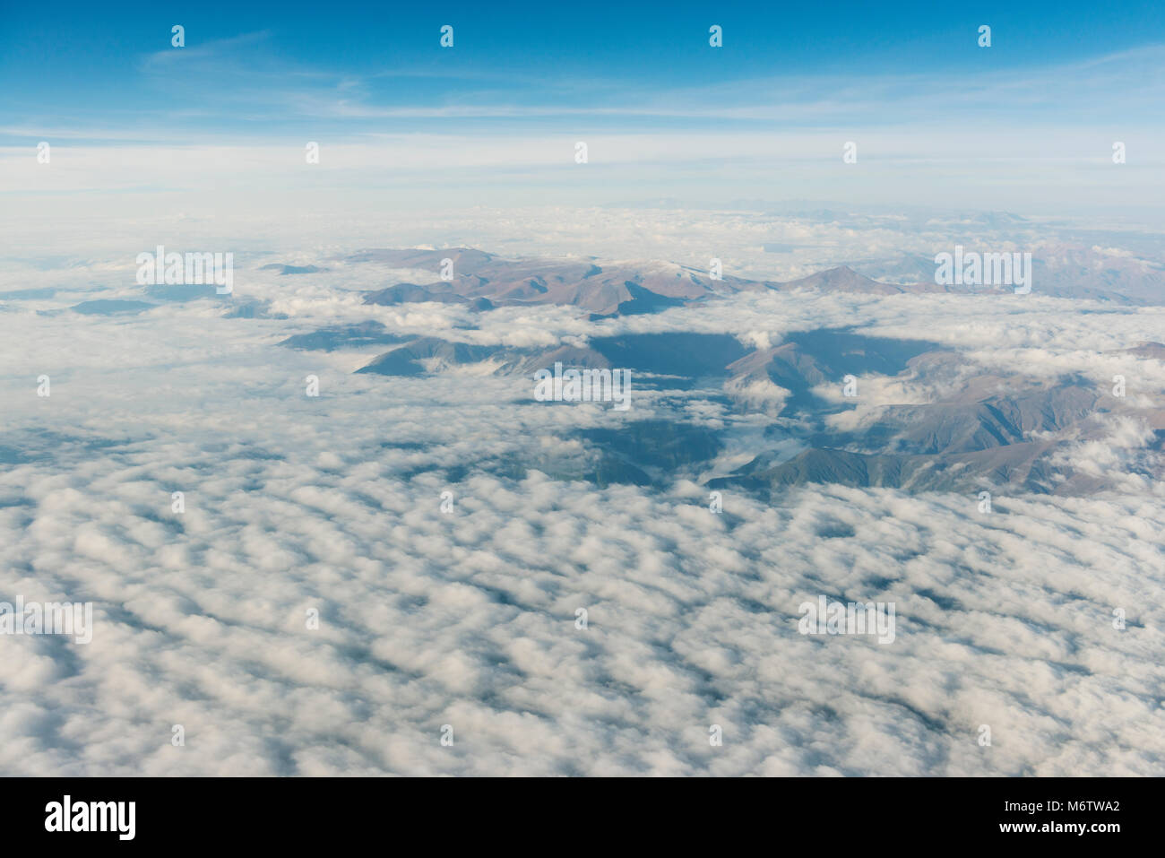 Airplane window view over the Argentinian high Andes mountains ...