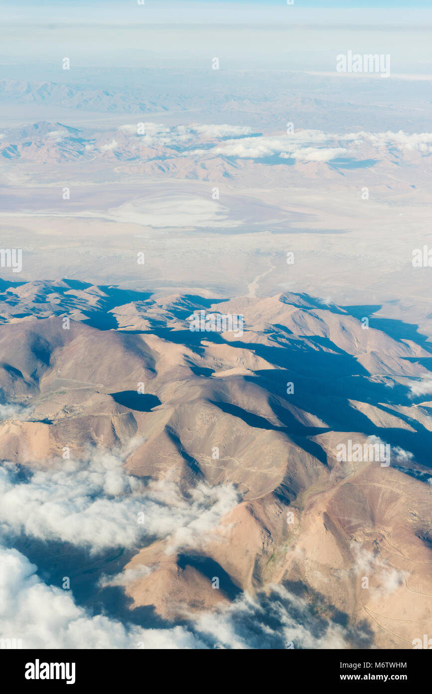 Airplane window view over the Argentinian high Andes mountains ...