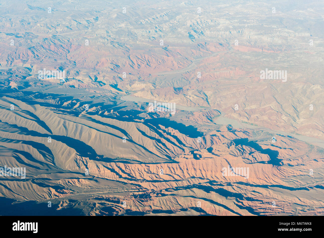 Airplane window view over the Argentinian high Andes mountains ...