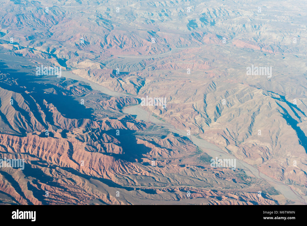 Airplane window view over the Argentinian high Andes mountains ...