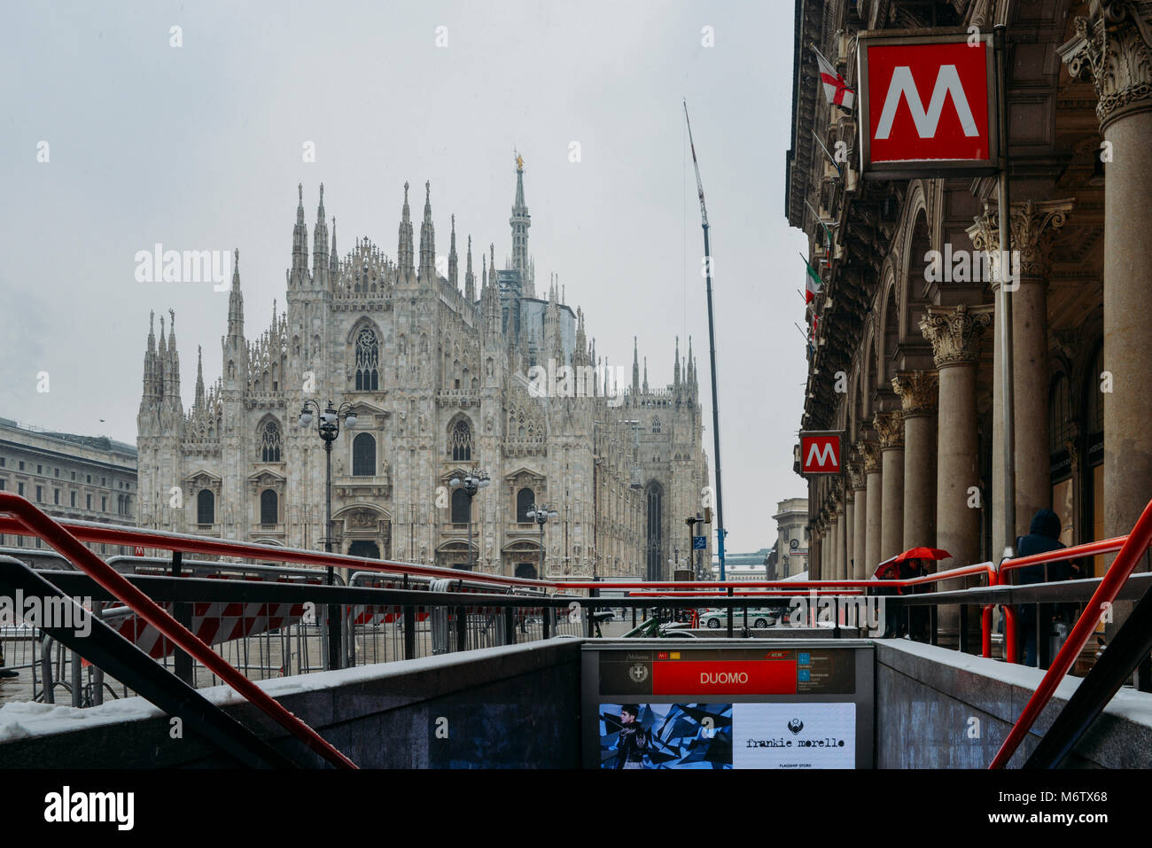 Gothic facade of Milan Cathedral in Piazza del Duomo with lamps and ...