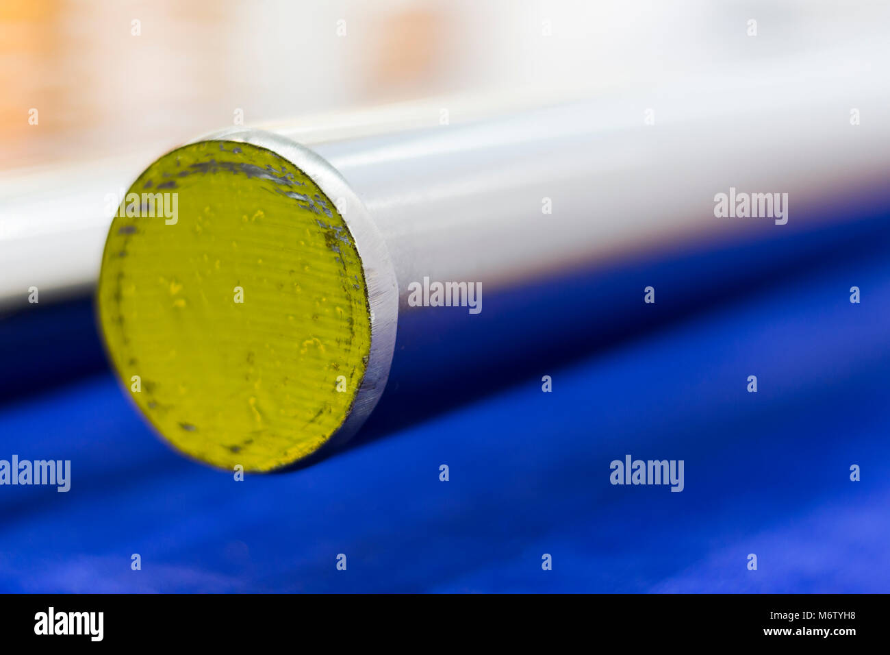 Round stainless steel bar ; grinding process Stock Photo - Alamy