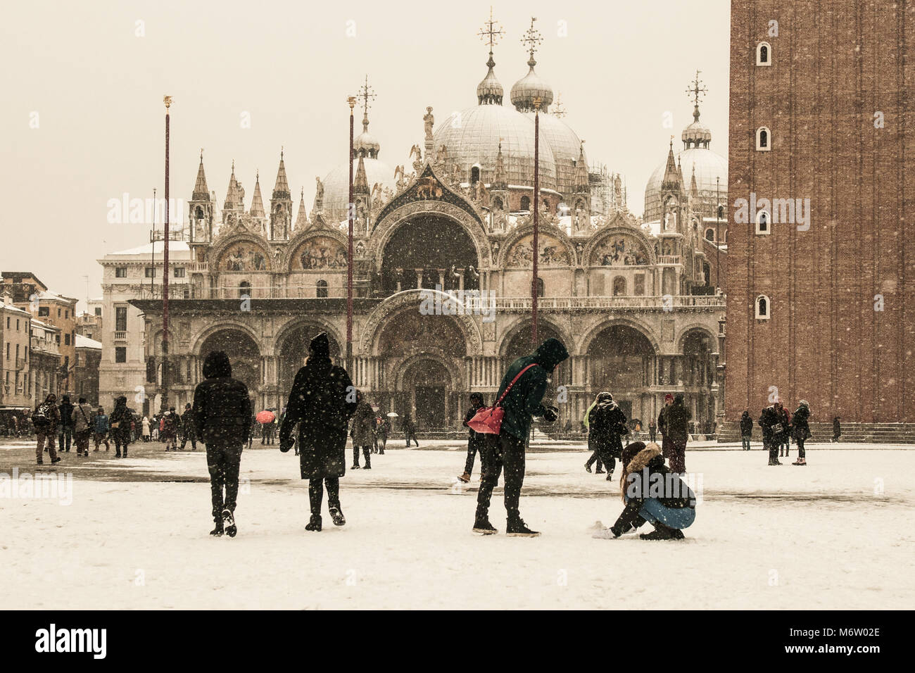 VENICE, ITALY - 28th FEBRUARY/01st MARCH 2018 Tourists play with the ...