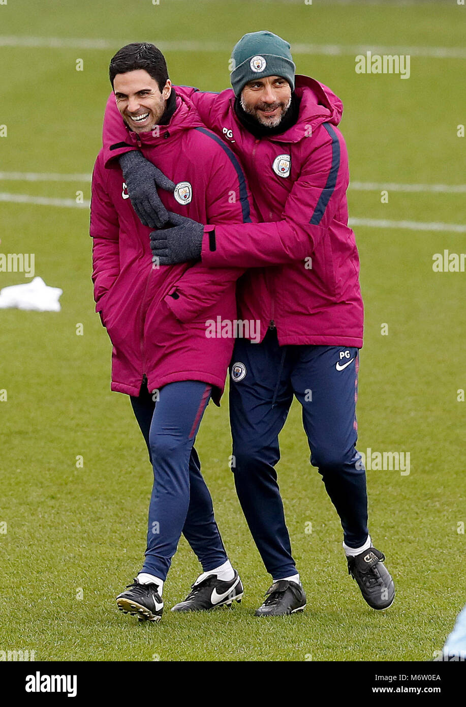 Manchester City manager Pep Guardiola (right) with assistant coach ...
