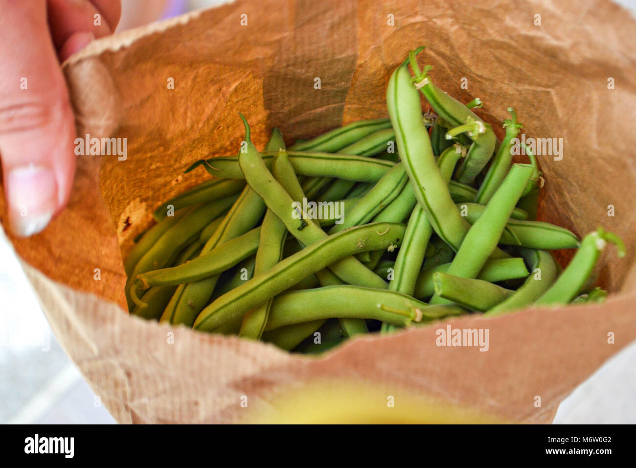 Green peas in the paper bag, closeup food photography Stock Photo - Alamy