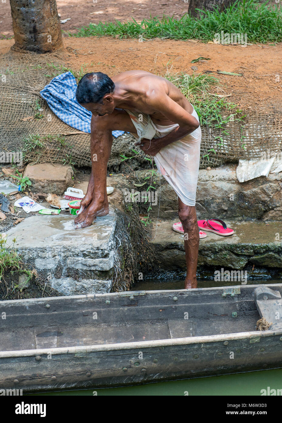 Man washing in the river in Kerala Backwaters at Alappuzha (Alleppey ...