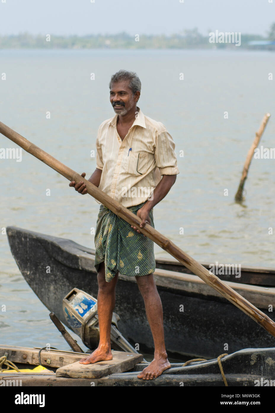 Boatman wearing lungi in Cochin, Kerala, India Stock Photo - Alamy