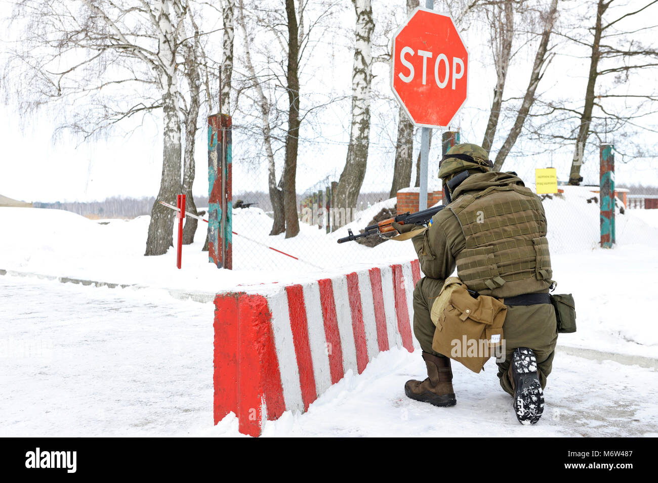Ukrainian soldiers took position guarding roadblock. National guard of ...