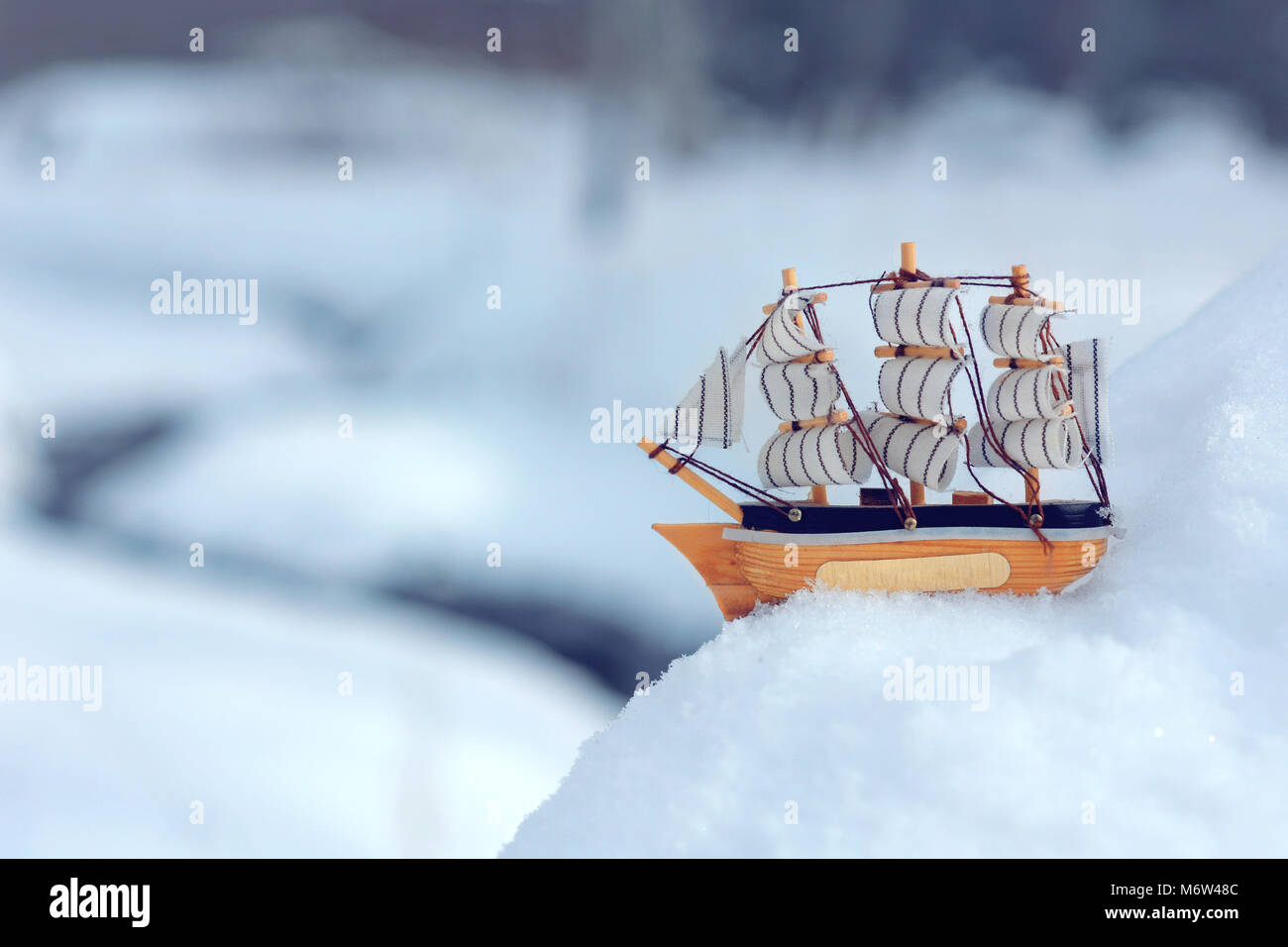 Climate change, global warming concept. Miniature ship with sails and ...