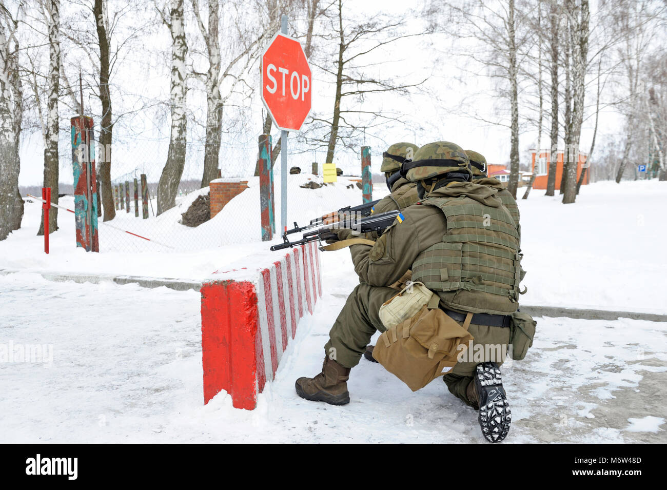 Ukrainian soldiers took position guarding roadblock. National guard of ...