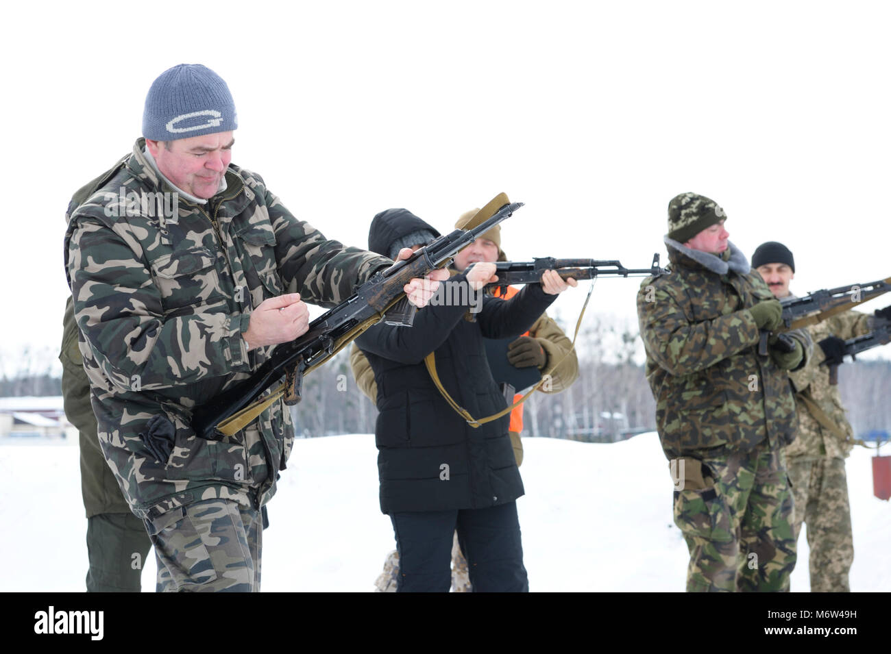 Ukrainian conscripts checking Kalashnikov rifles before training in ...