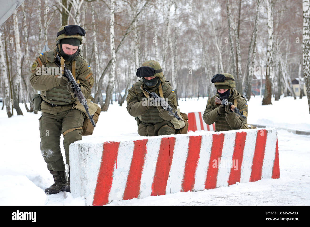 Ukrainian soldiers took position guarding roadblock. National guard of ...