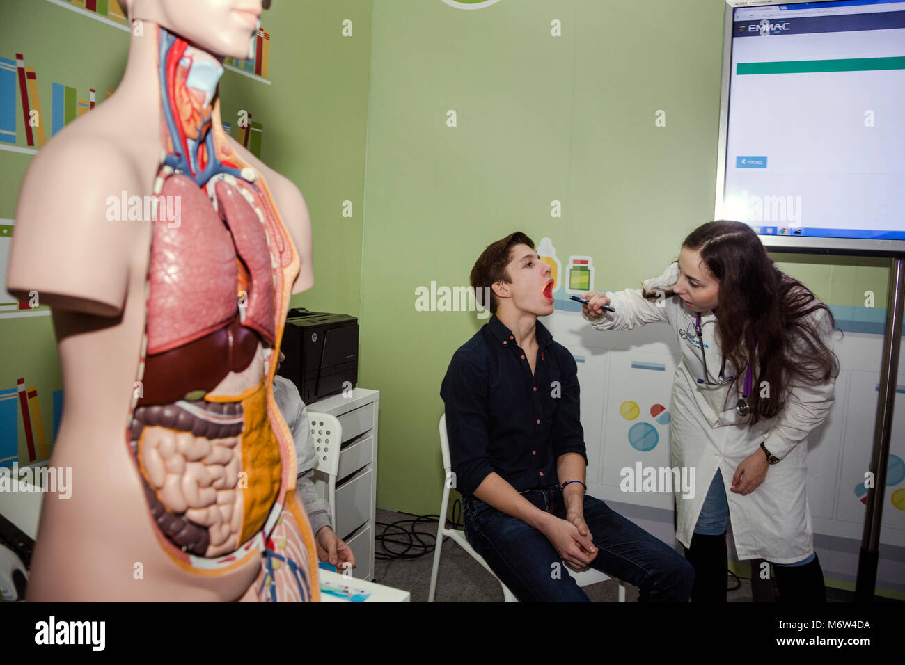 A doctor checks the patient's health at the children's interactive ...