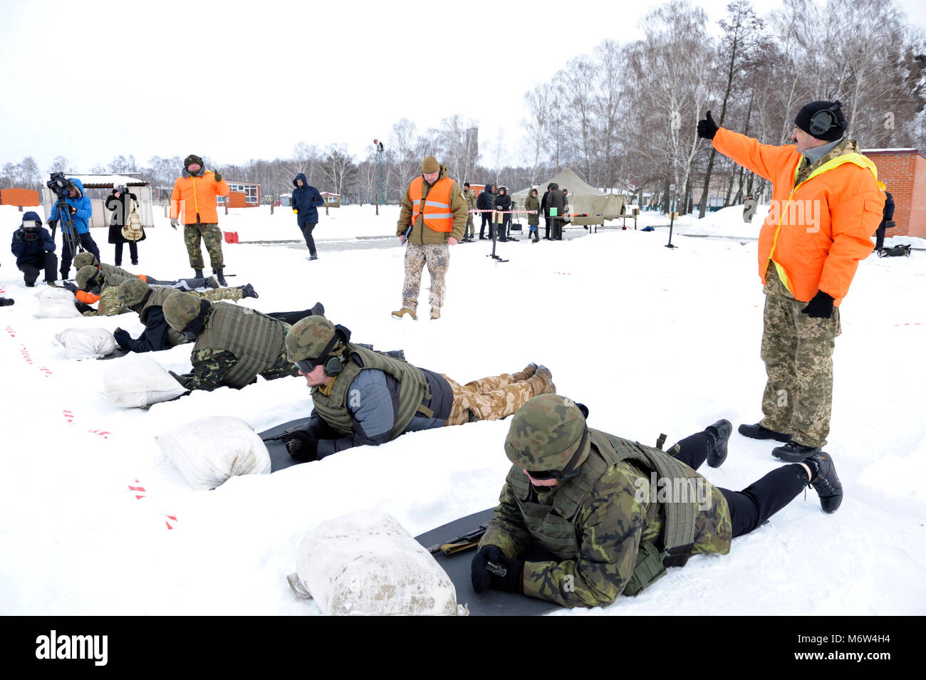 Ukrainian conscripts took position on shooting range laying on carpets ...
