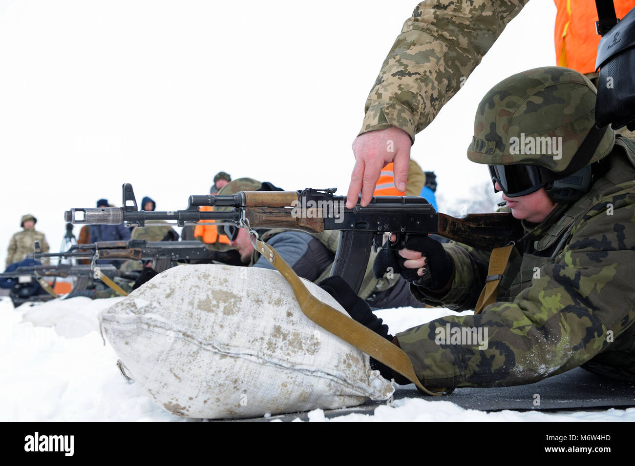Ukrainian conscripts took position on shooting range laying on carpets ...