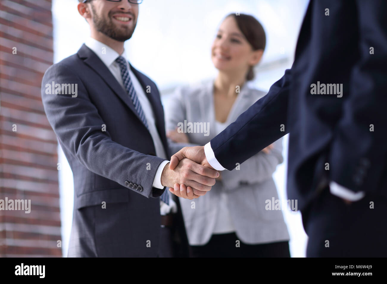 Two Business men shaking hands Stock Photo - Alamy
