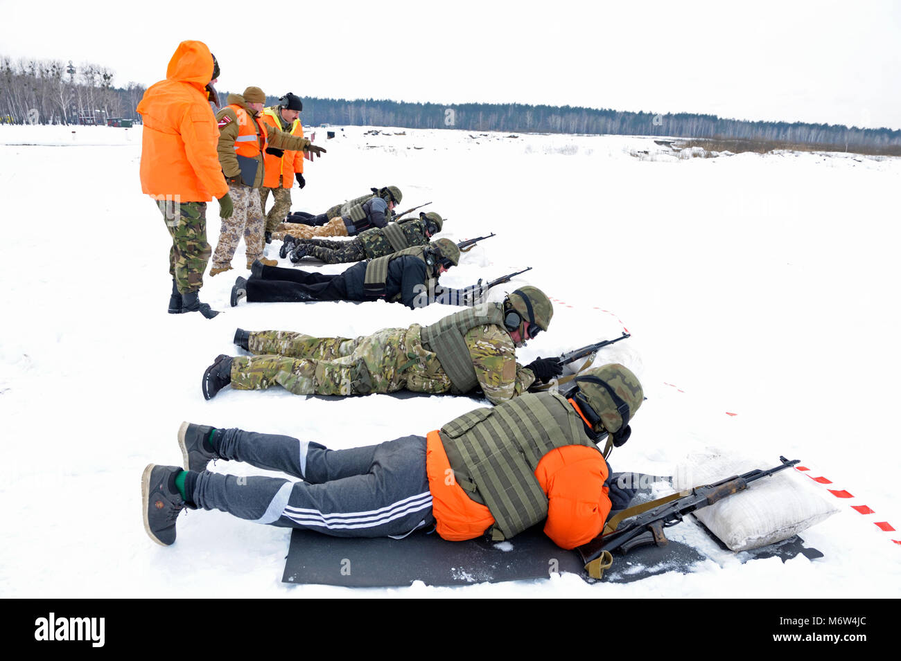 Ukrainian conscripts took position on shooting range laying on carpets ...