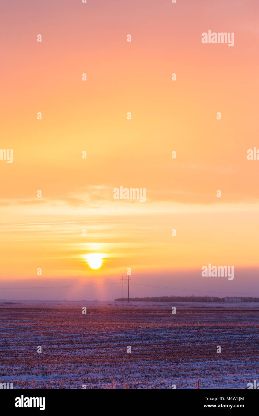 Beautiful winter sunrise over a rural field Stock Photo - Alamy