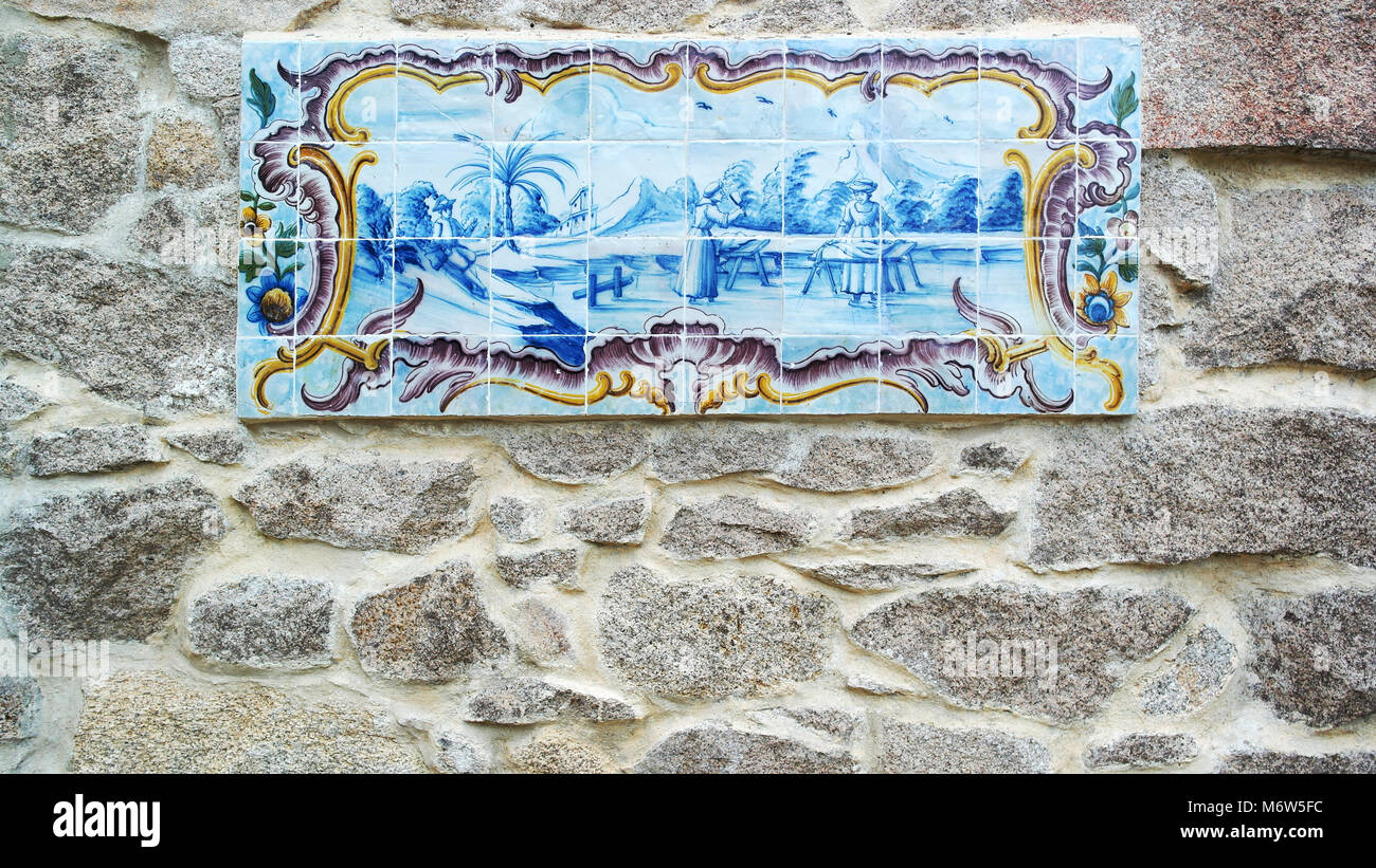 Detail of some azulejos and a stone wall Stock Photo - Alamy