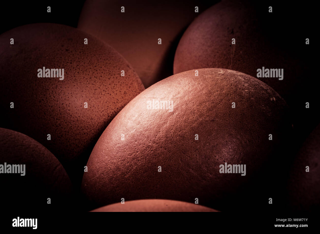 eggs colored with natural dye on brown dish, toned, vintage Stock Photo ...