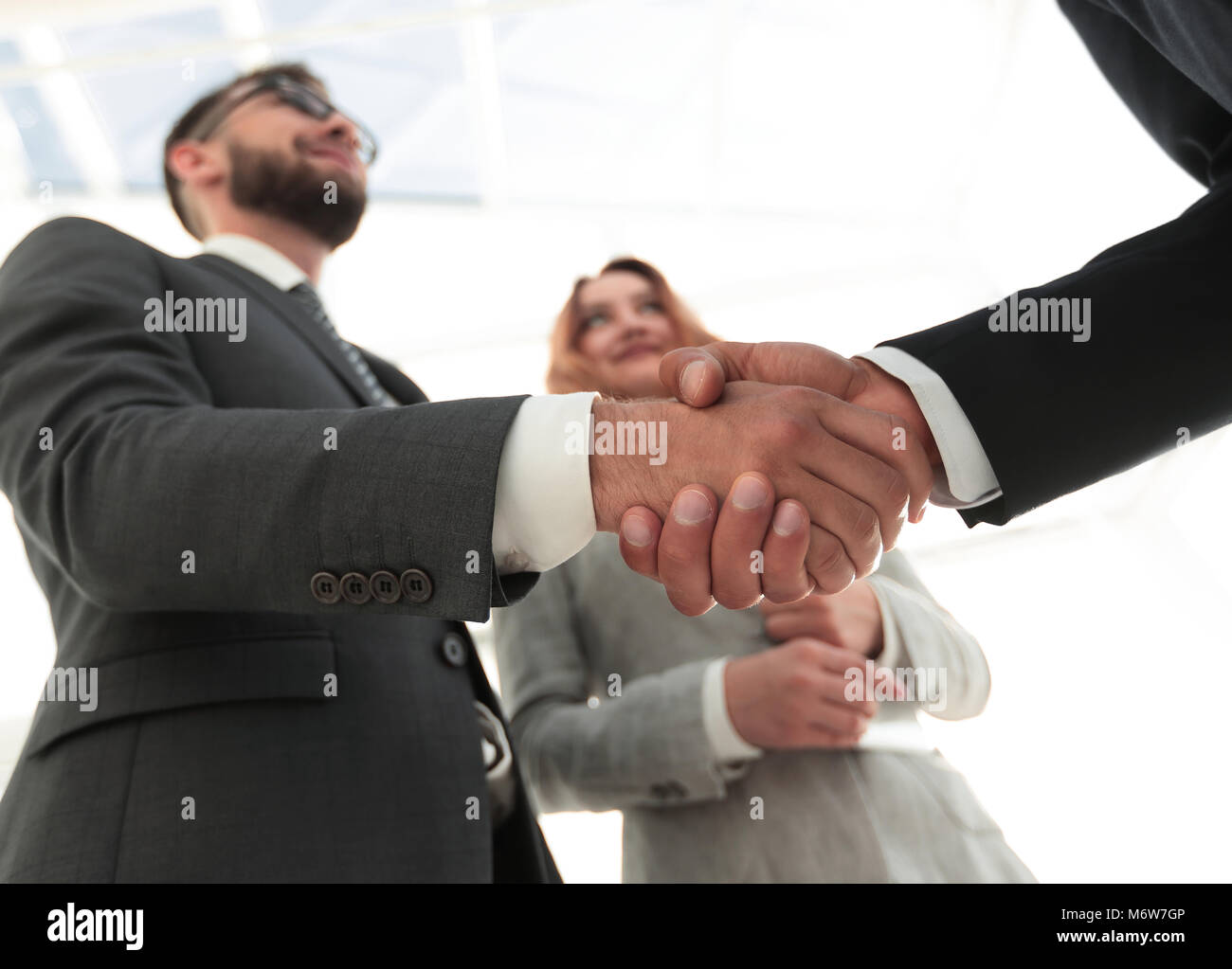 Photo of handshake of two happy businessmen Stock Photo - Alamy