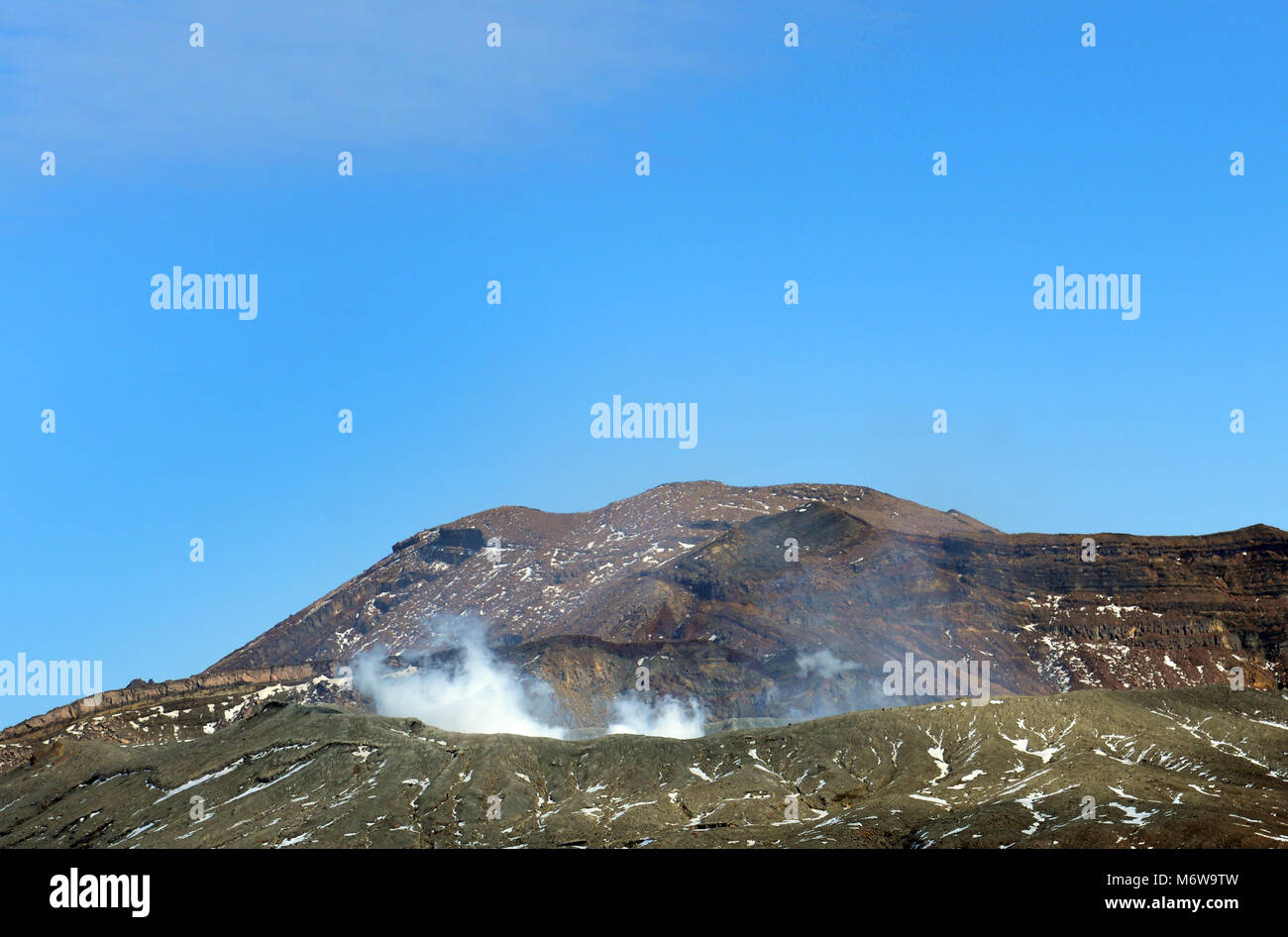 Mt. Aso volcano with the Nakadake crater spewing sulfur steam Stock ...