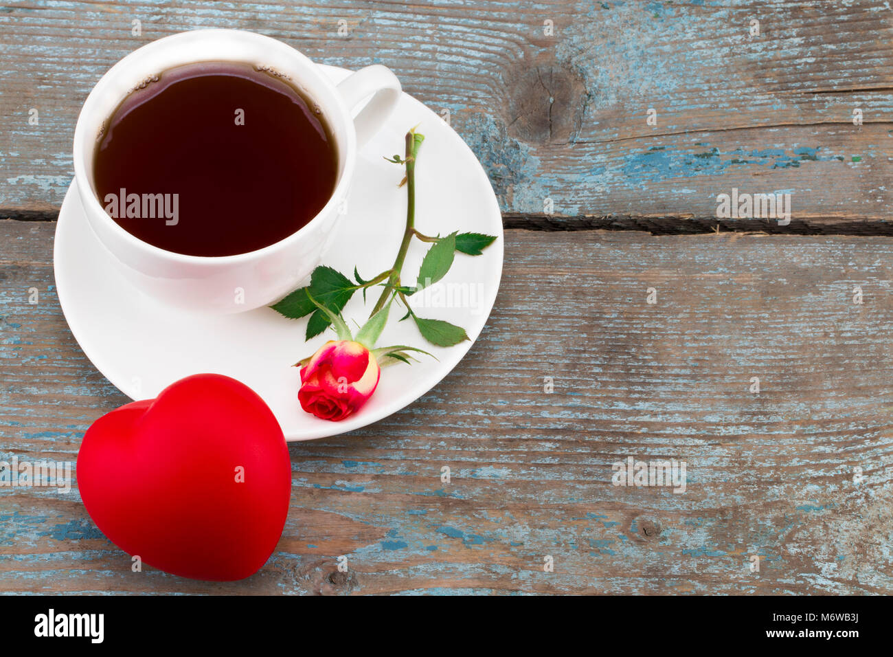 coffee cup,heart and red rose wooden background for Valentines day with ...