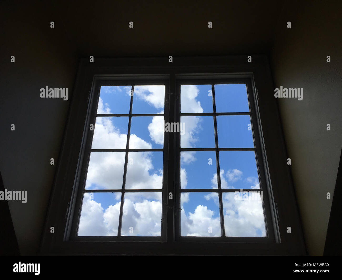 Window with blue skies and clouds Stock Photo - Alamy