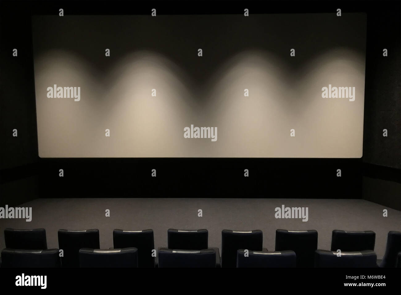 Movie theater seen from the seat rows Stock Photo - Alamy