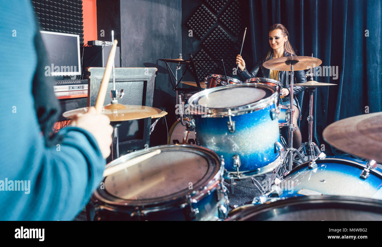 Woman receiving drum lessons from her music teacher in school Stock ...