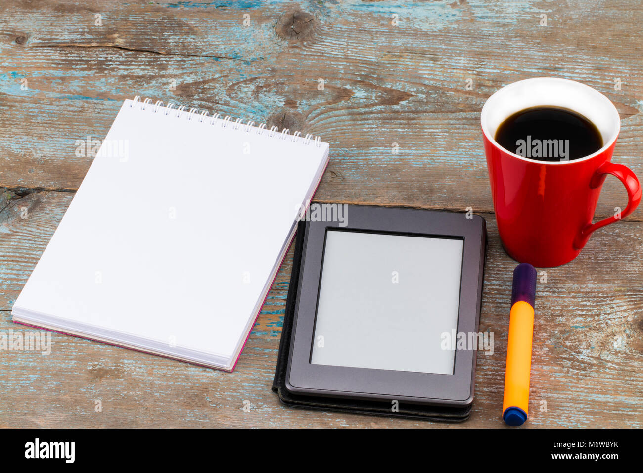 Digital Tablet Computer with Blank White Screen as Copy Space and a cup ...