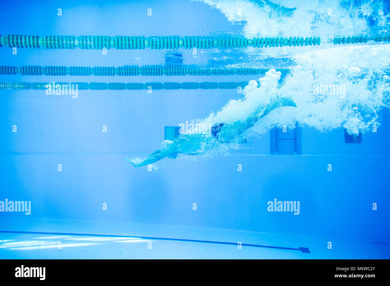 Senior man jumping in the swimming pool Stock Photo - Alamy