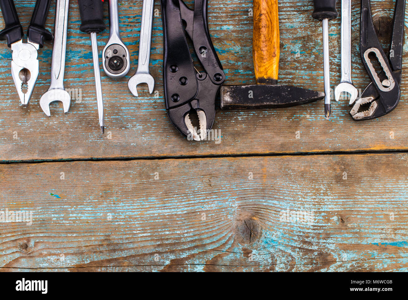 Set of tools over a wooden background with space for text Stock Photo ...