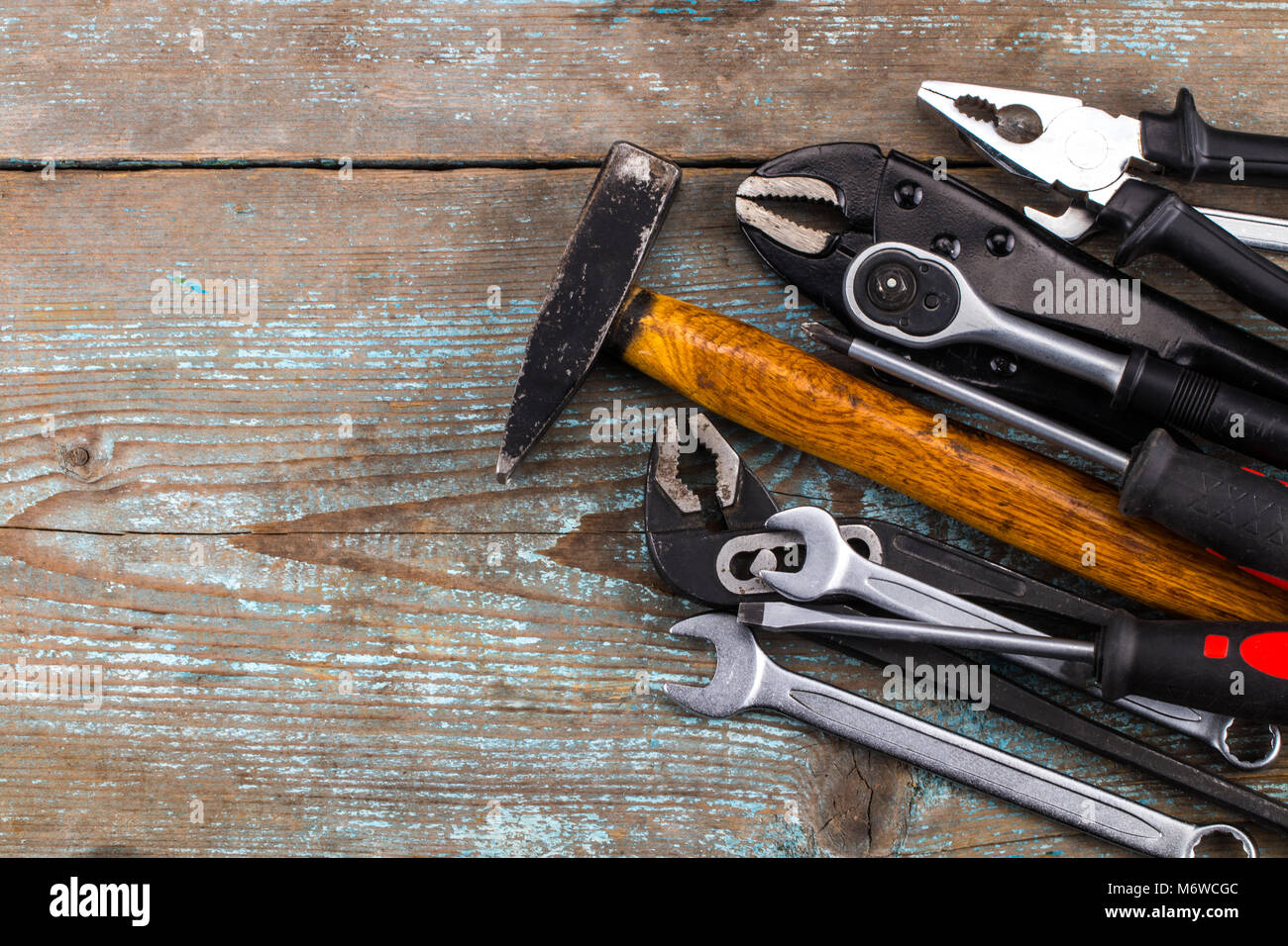 Set of tools over a wooden background with space for text Stock Photo ...
