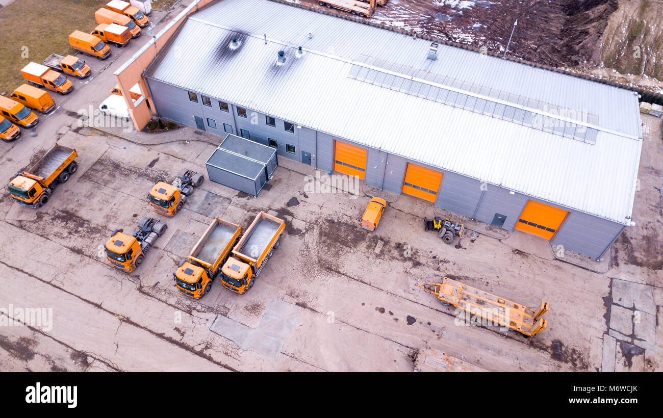 Aerial view over a workshop, factory, recycling facility, warehouse ...