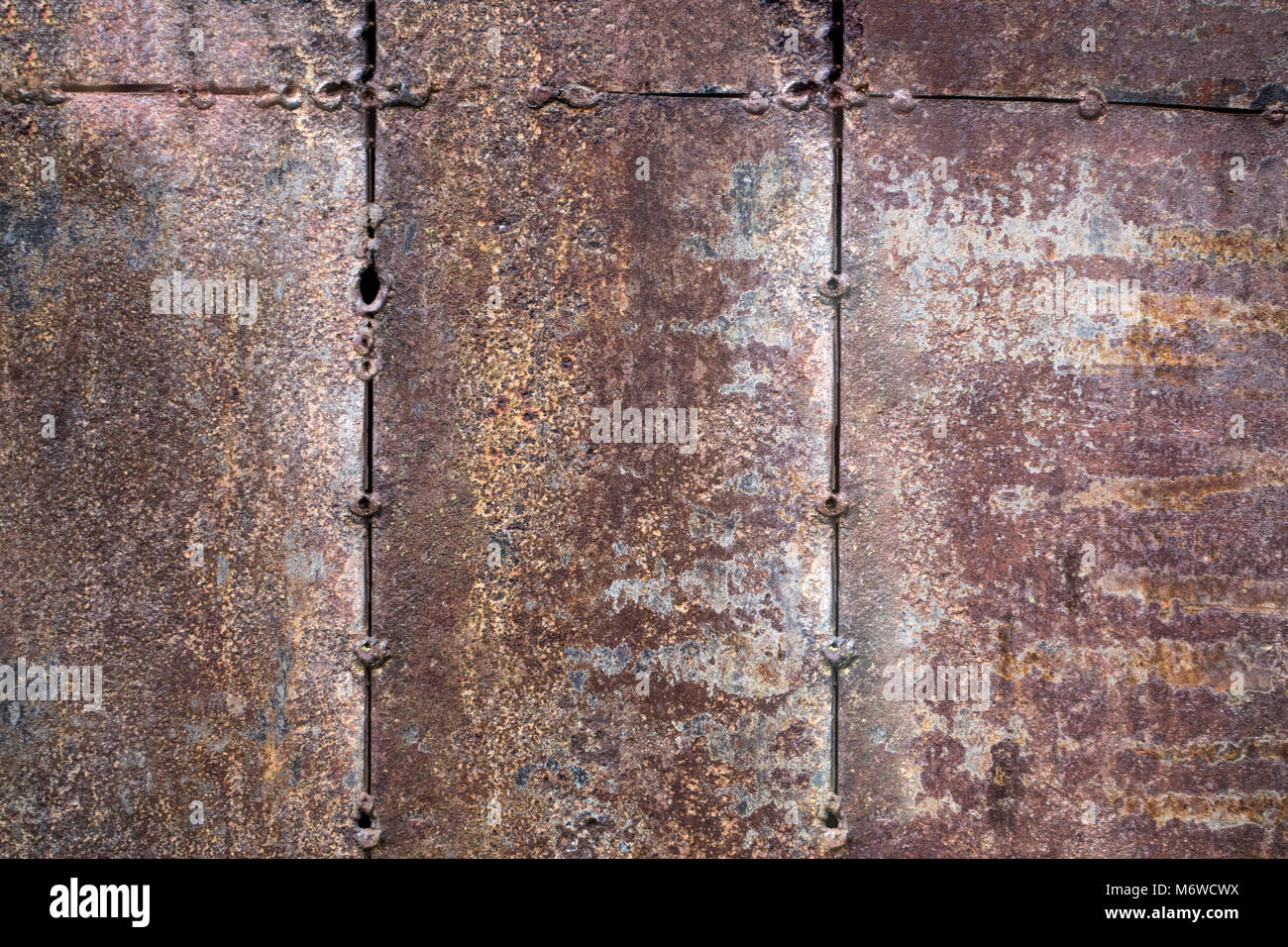 Worn dark brown rusty metal texture background. the concept of three ...