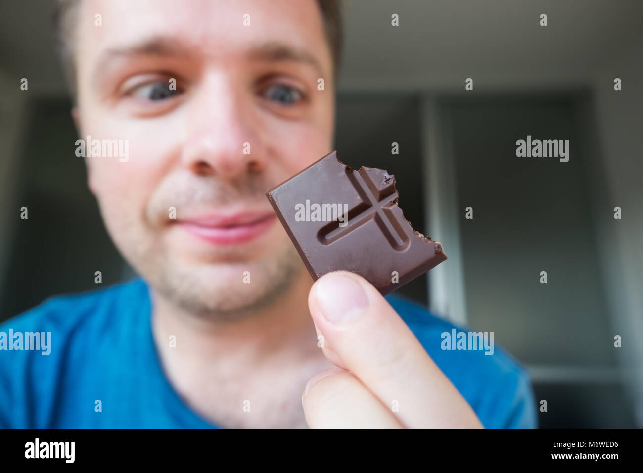 Man eating chocolate hi-res stock photography and images - Alamy