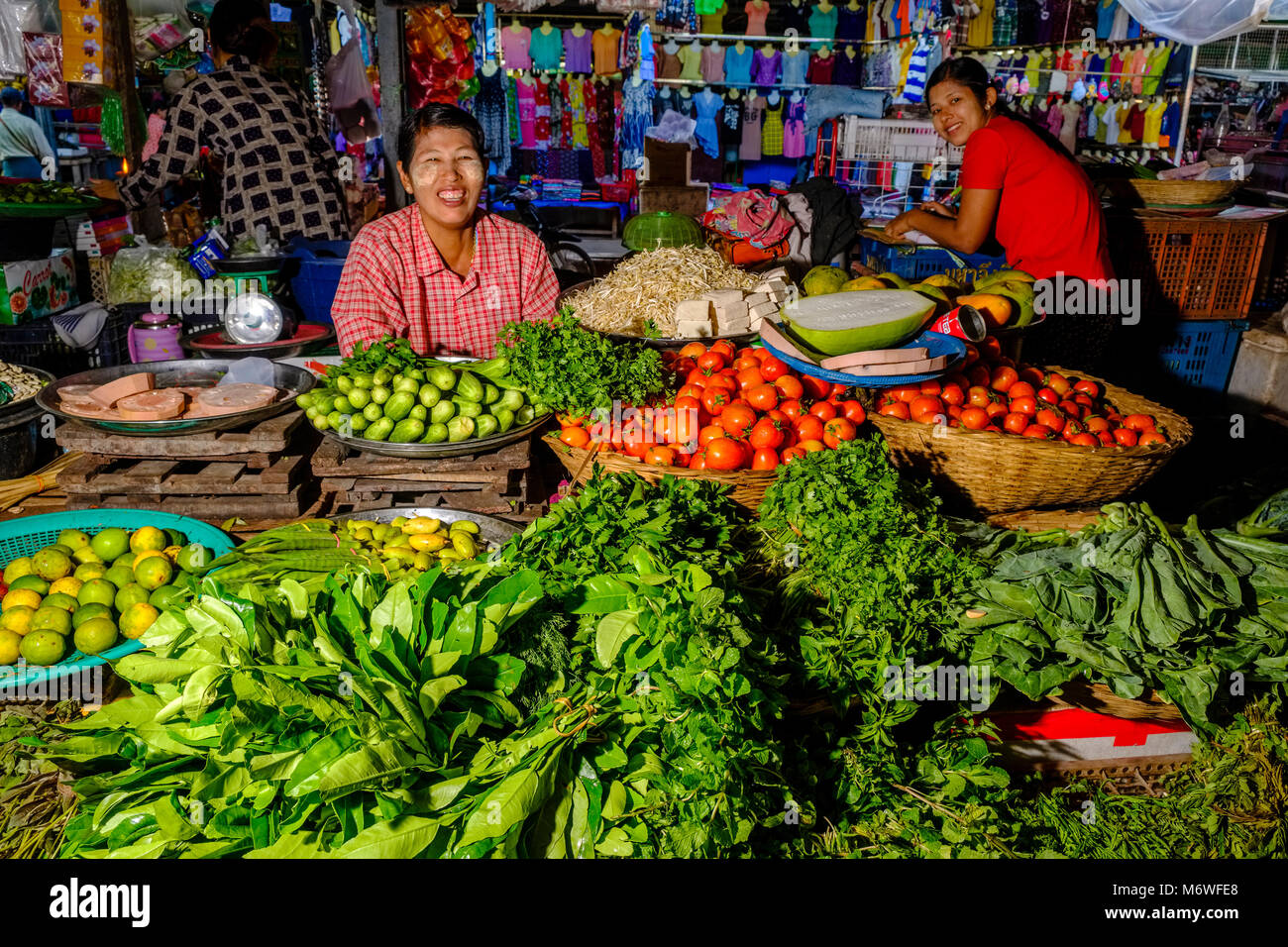 A local farmers woman is selling vegetables in the street market of ...
