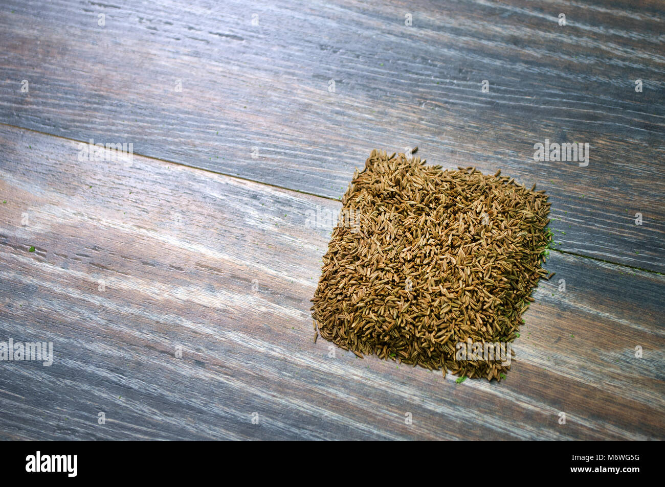 Various forms of carum carvi on a wooden background Stock Photo - Alamy