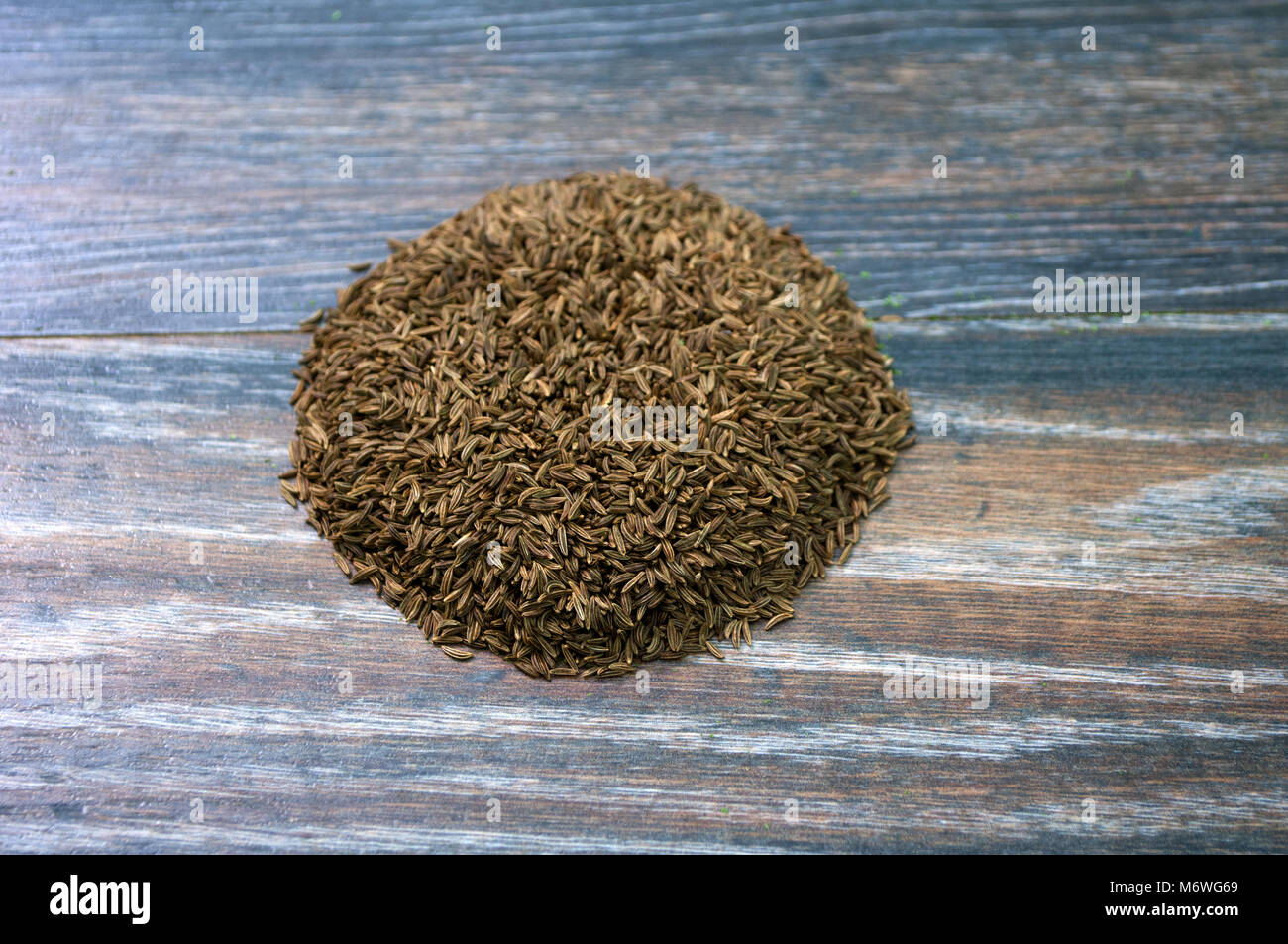 Various forms of carum carvi on a wooden background Stock Photo - Alamy