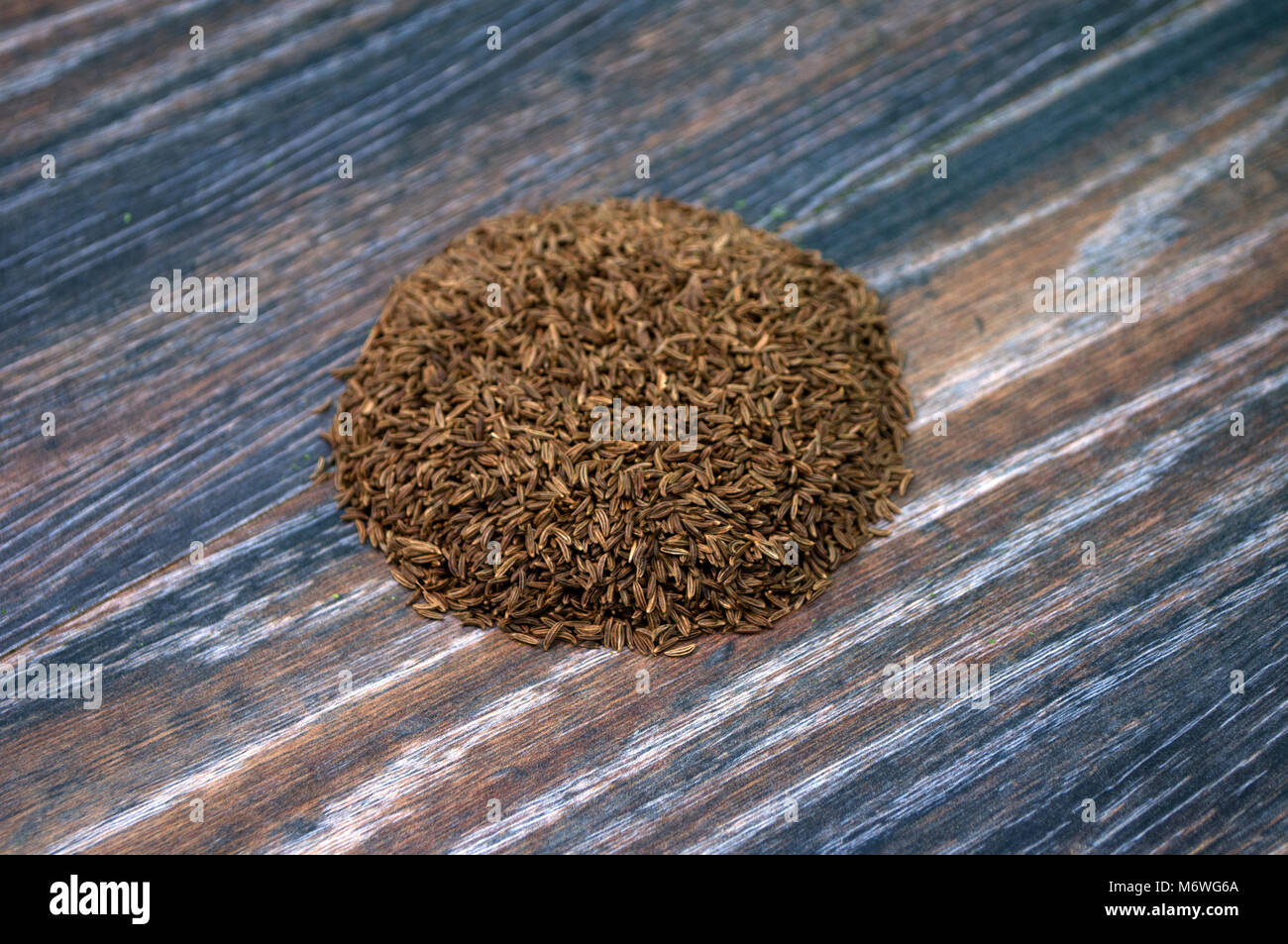 Various forms of carum carvi on a wooden background Stock Photo - Alamy