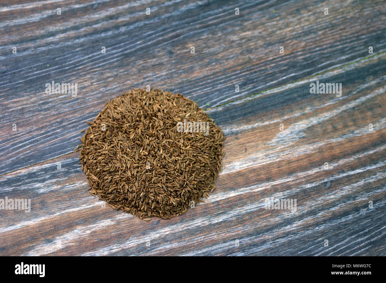 Various forms of carum carvi on a wooden background Stock Photo - Alamy