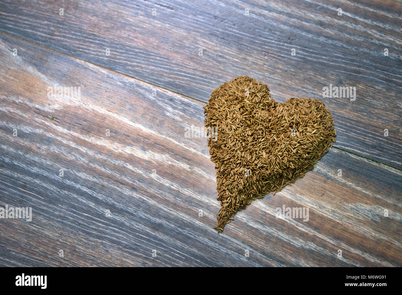 Various forms of carum carvi on a wooden background Stock Photo - Alamy