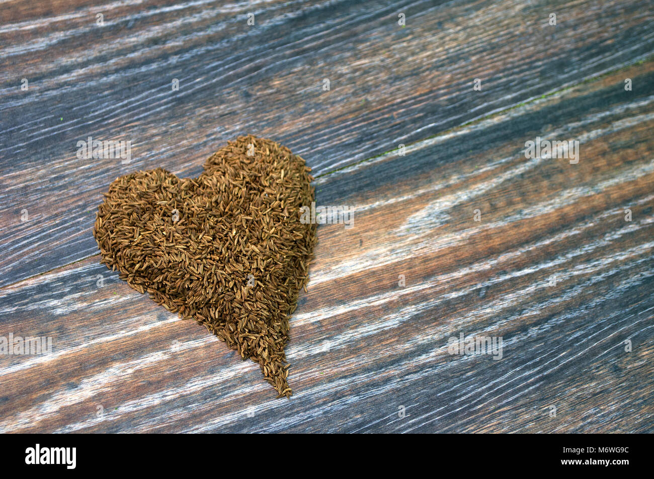 Various forms of carum carvi on a wooden background Stock Photo - Alamy
