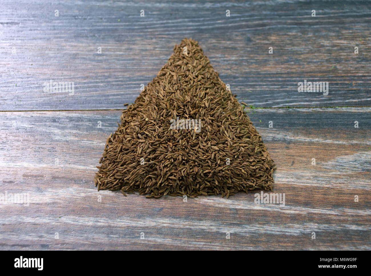 Various forms of carum carvi on a wooden background Stock Photo - Alamy